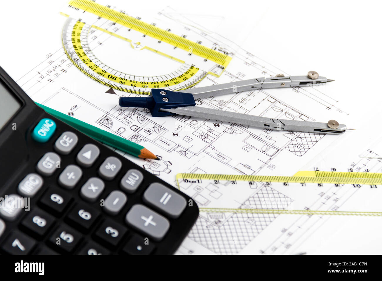 Photo of the Architectural project, pair of compasses, rulers and ...