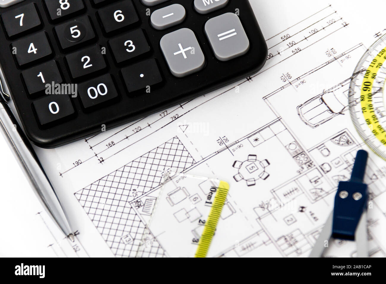 Photo of the Architectural project, pair of compasses, rulers and ...