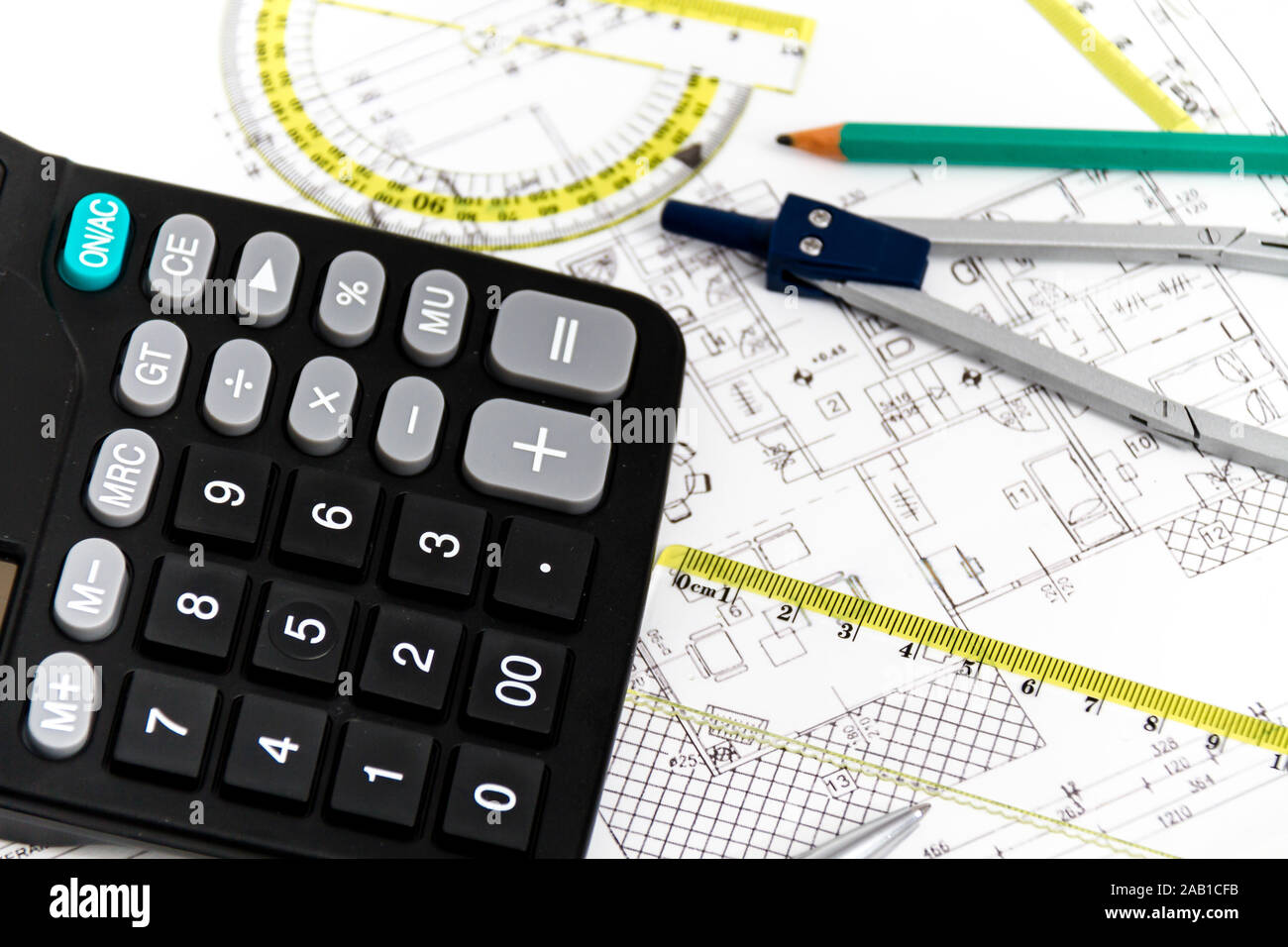 Photo of the Architectural project, pair of compasses, rulers and ...