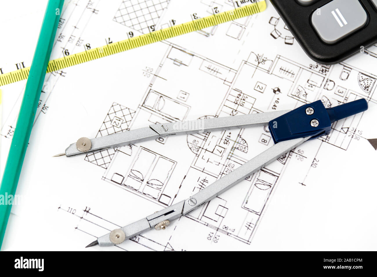 Photo of the Architectural project, pair of compasses, rulers and ...