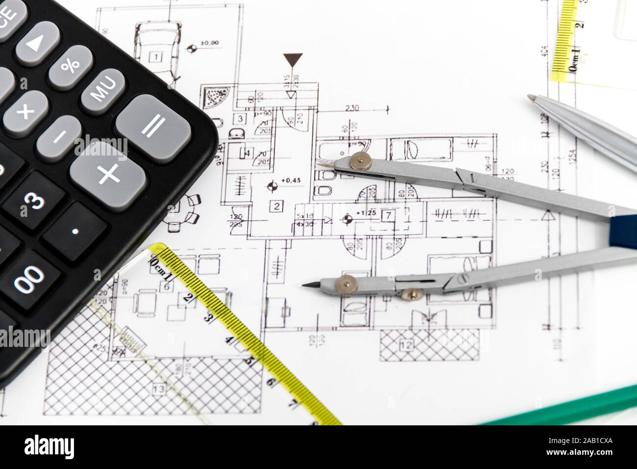 Photo of the Architectural project, pair of compasses, rulers and ...