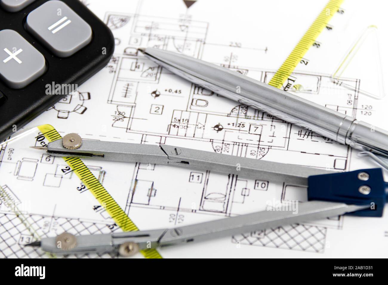 Photo of the Architectural project, pair of compasses, rulers and ...