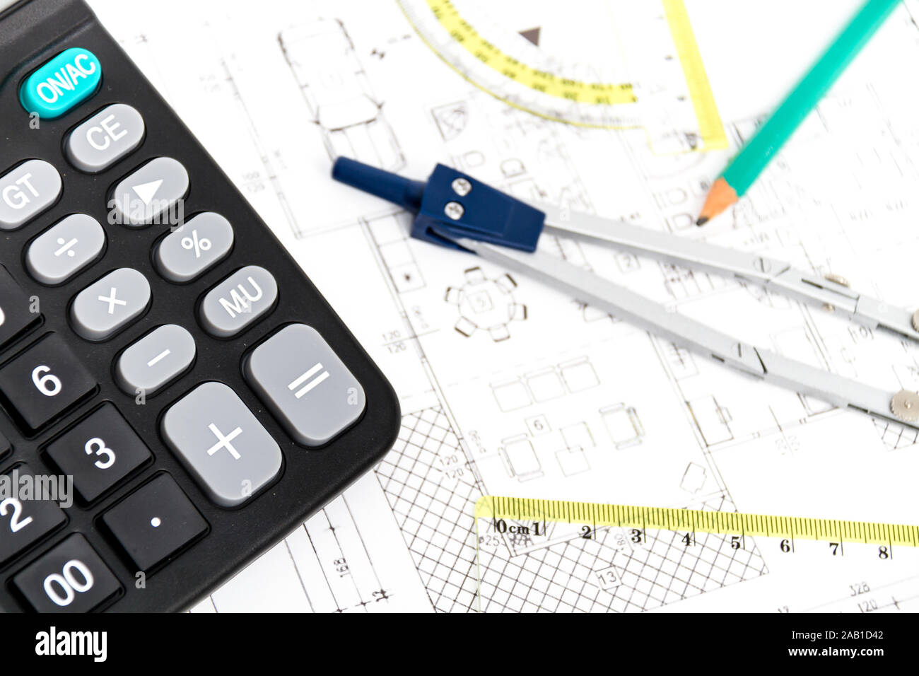 Photo of the Architectural project, pair of compasses, rulers and ...