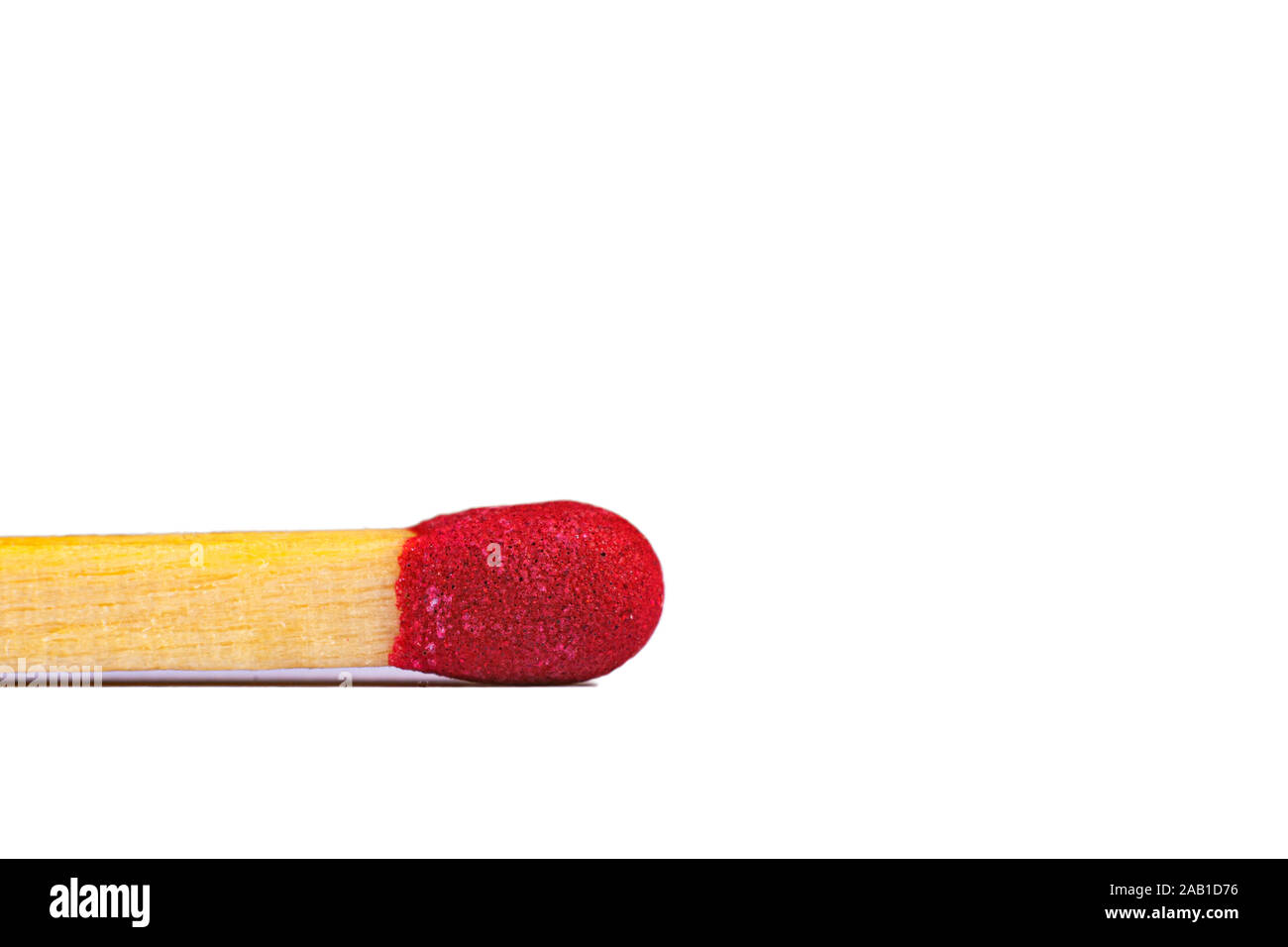 Isolated macro shot of a single match laying flat on a pure white ...