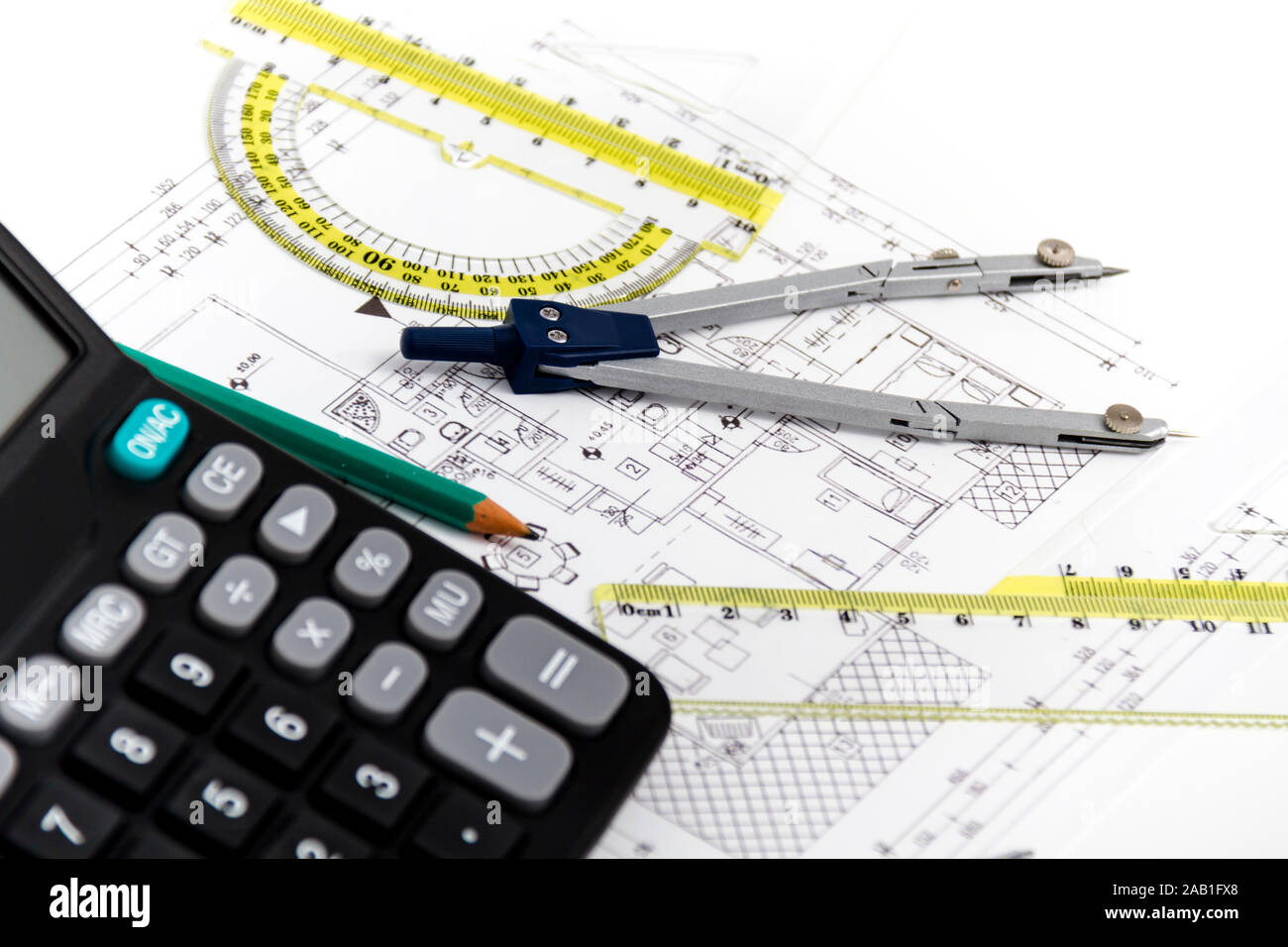 Photo of the Architectural project, pair of compasses, rulers and calculator Stock Photo - Alamy