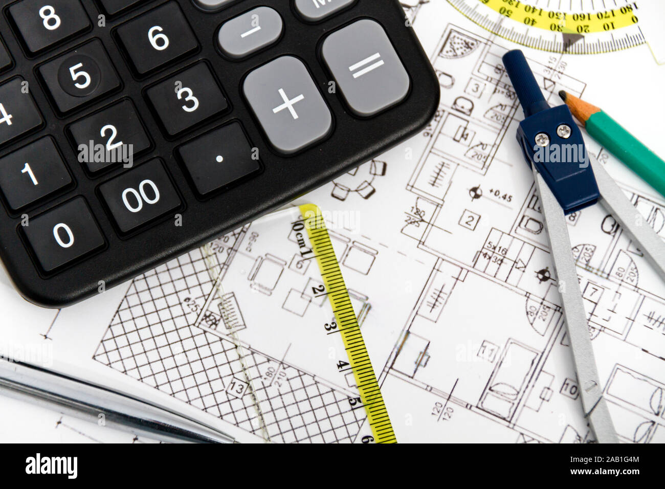 Photo of the Architectural project, pair of compasses, rulers and ...