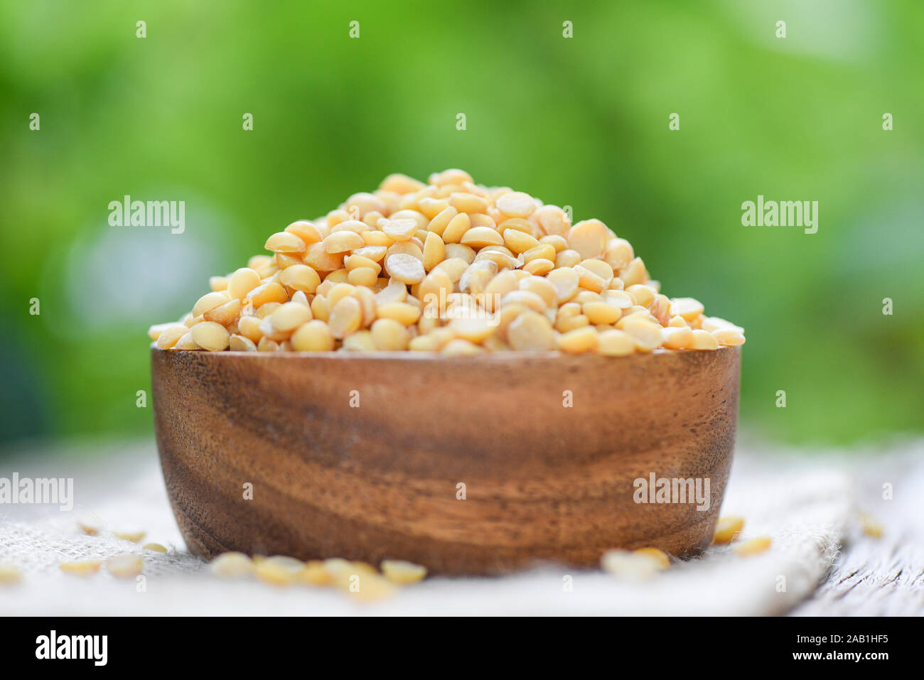 Soybean in a wooden bowl with nature green background / Peeled Split ...