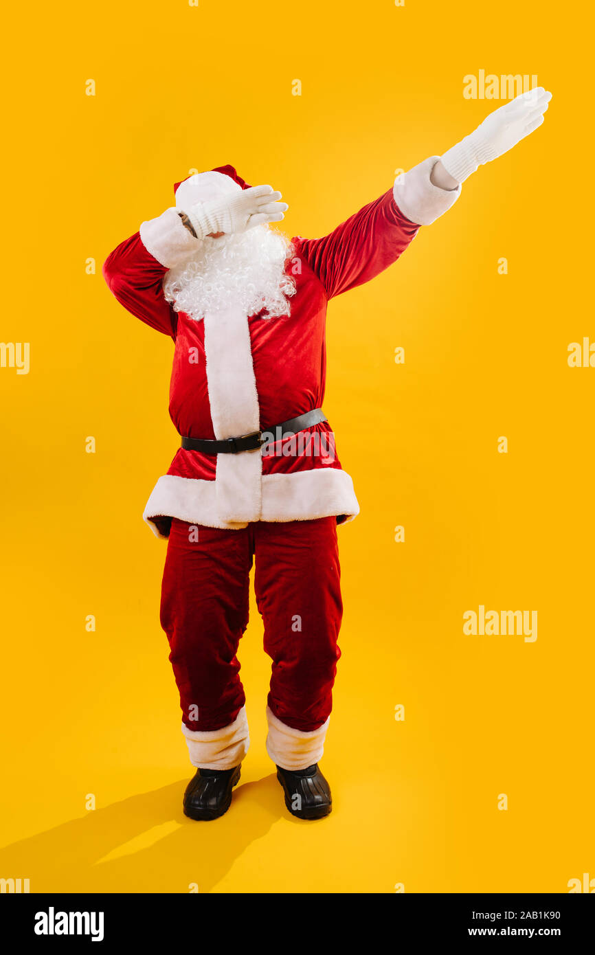 Happy dancing Santa Claus squating and waving hands Stock Photo - Alamy
