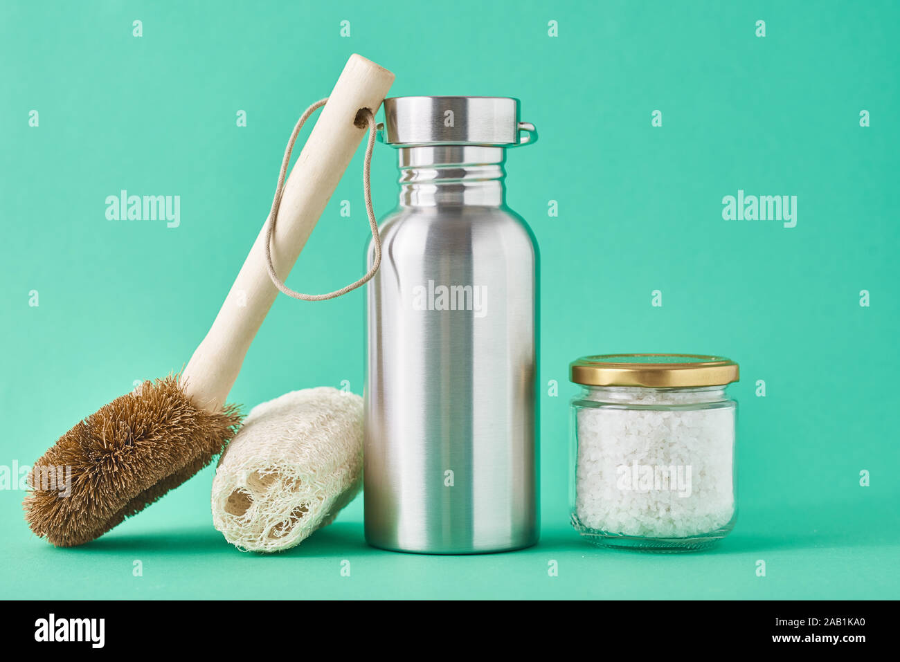 Set of eco friendly items on green background. Reusable aluminum bottle ...