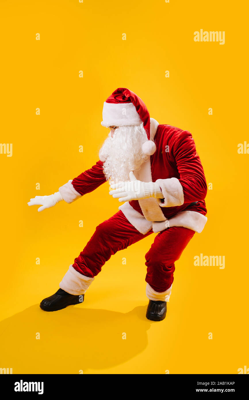 Happy dancing Santa Claus making peculiar moves Stock Photo - Alamy
