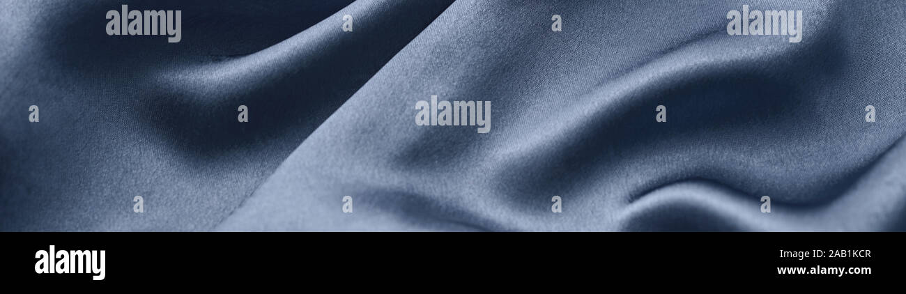 Silver silk background with folds. Abstract texture of rippled silk ...