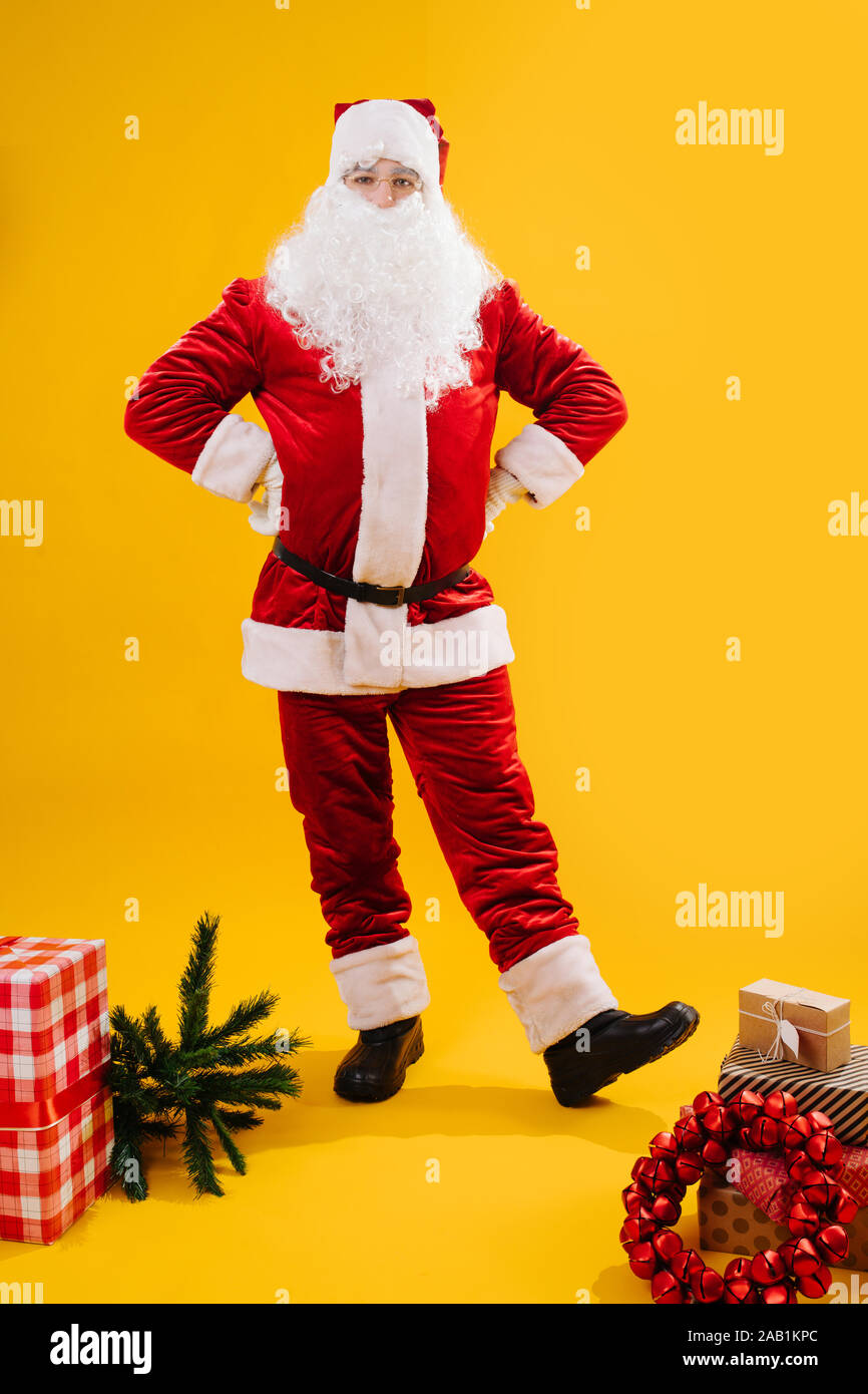 Happy dancing Santa Claus with hands on his waist, leg on heel Stock ...