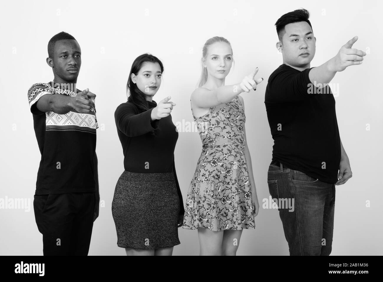 Studio shot of diverse group of multi ethnic friends thinking while ...