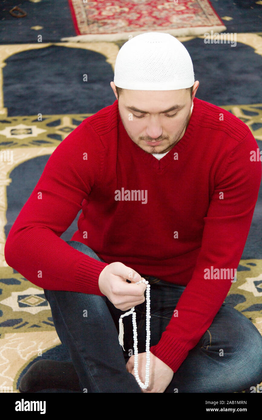 Photo of the Young muslim man showing Islamic prayer Stock Photo - Alamy
