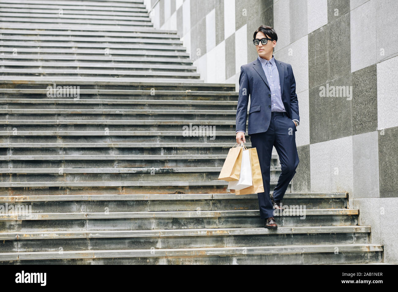 Professional male walking down steps hi-res stock photography and ...