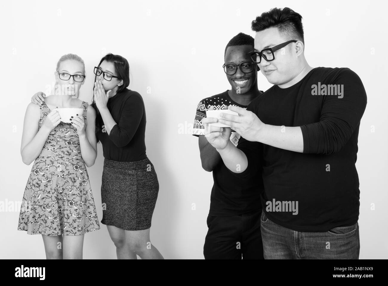 Happy diverse group of multi ethnic friends using mobile phone together ...