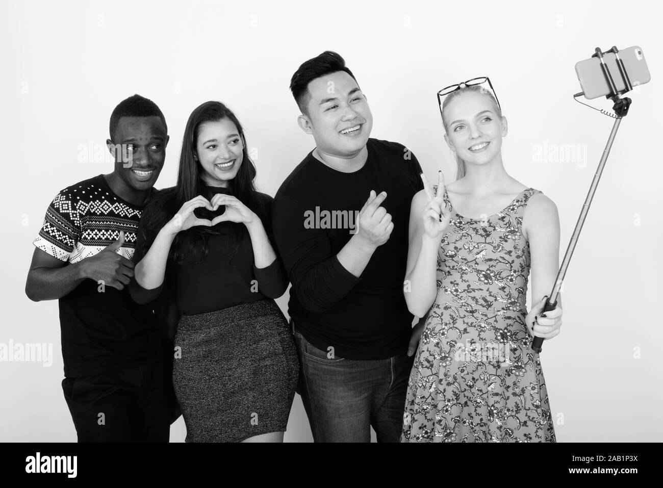 Happy diverse group of multi ethnic friends taking selfie with mobile ...