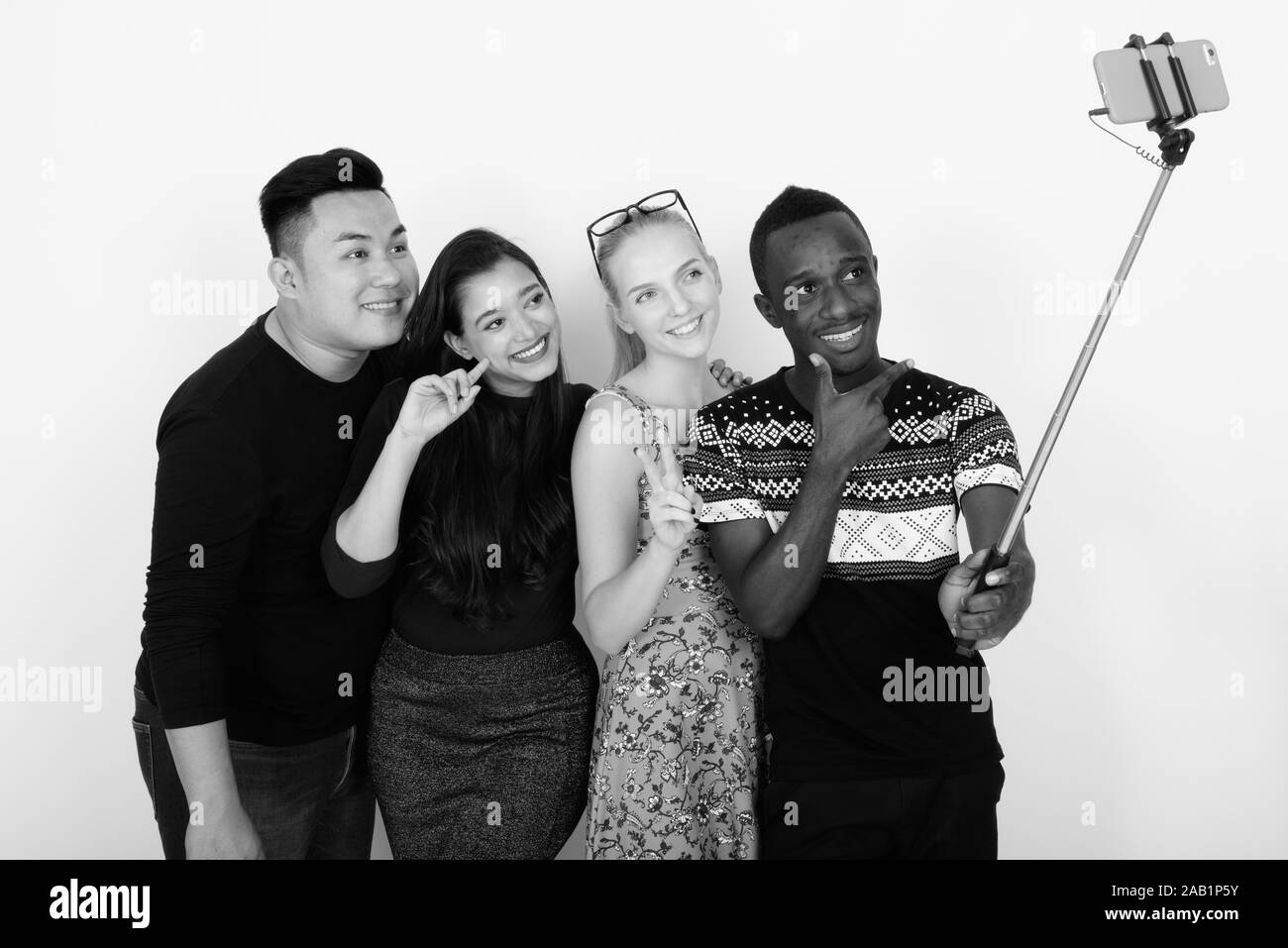 Happy diverse group of multi ethnic friends taking selfie picture with ...