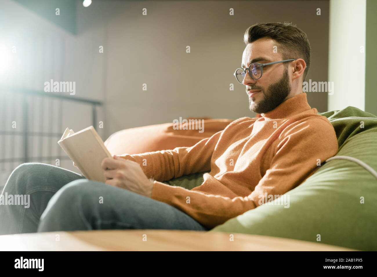 Relaxed young adult sofa hi-res stock photography and images - Alamy