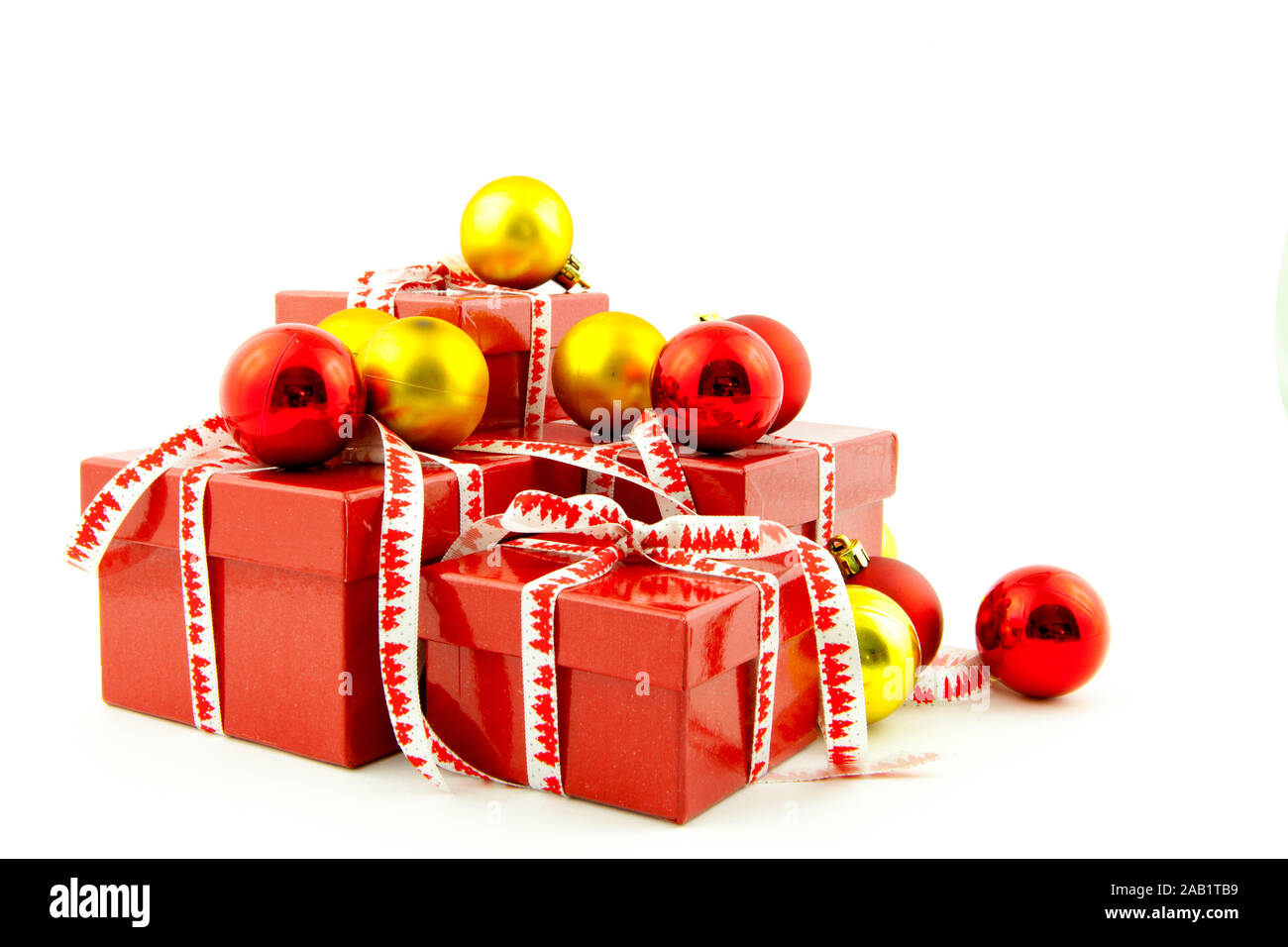 Christmas gifts with golden and red balls on white background Stock ...