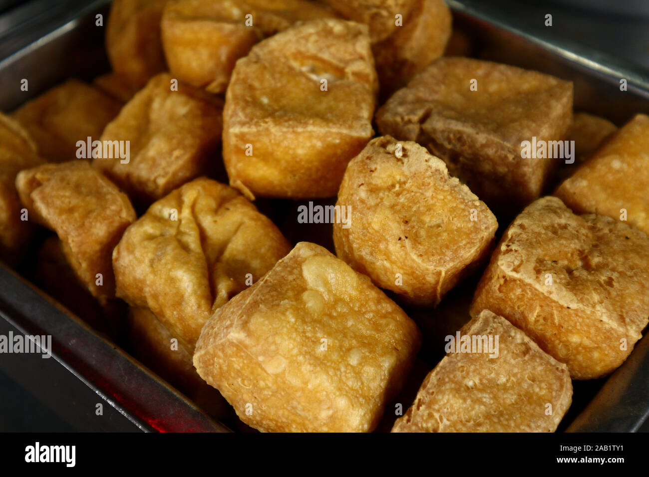 Photo of pile of freshly fried tofu or tokwa Stock Photo - Alamy