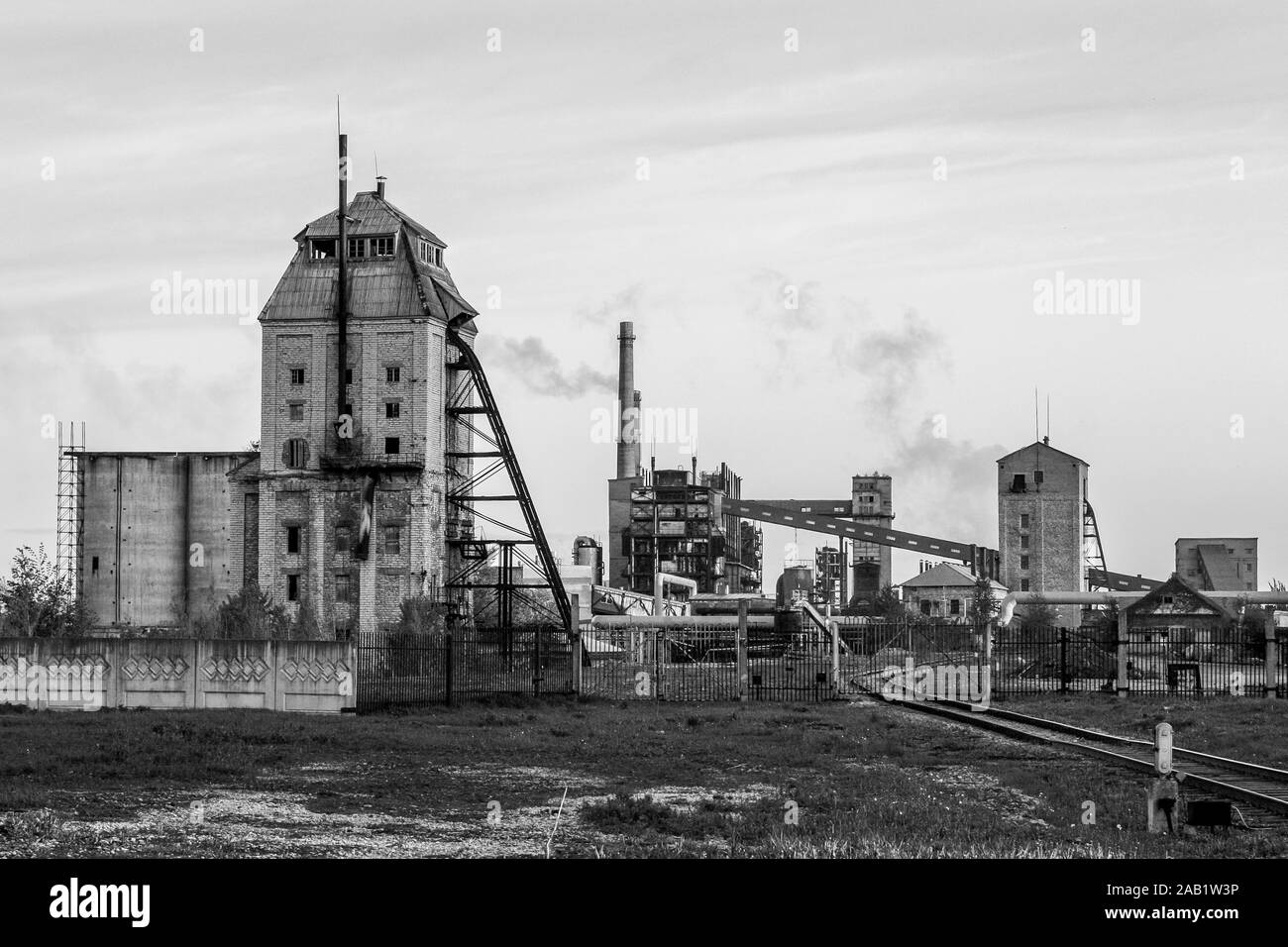 Old shale processing plant. Stylized black and white photo. Visible ...