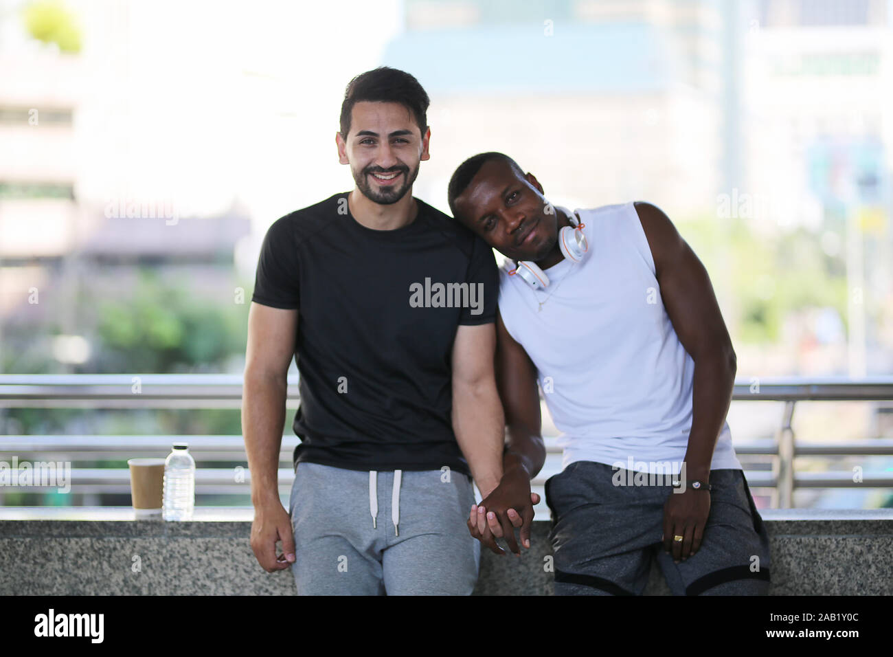 fitness, sport, exercising and lifestyle concept - Two man mix-race in ...