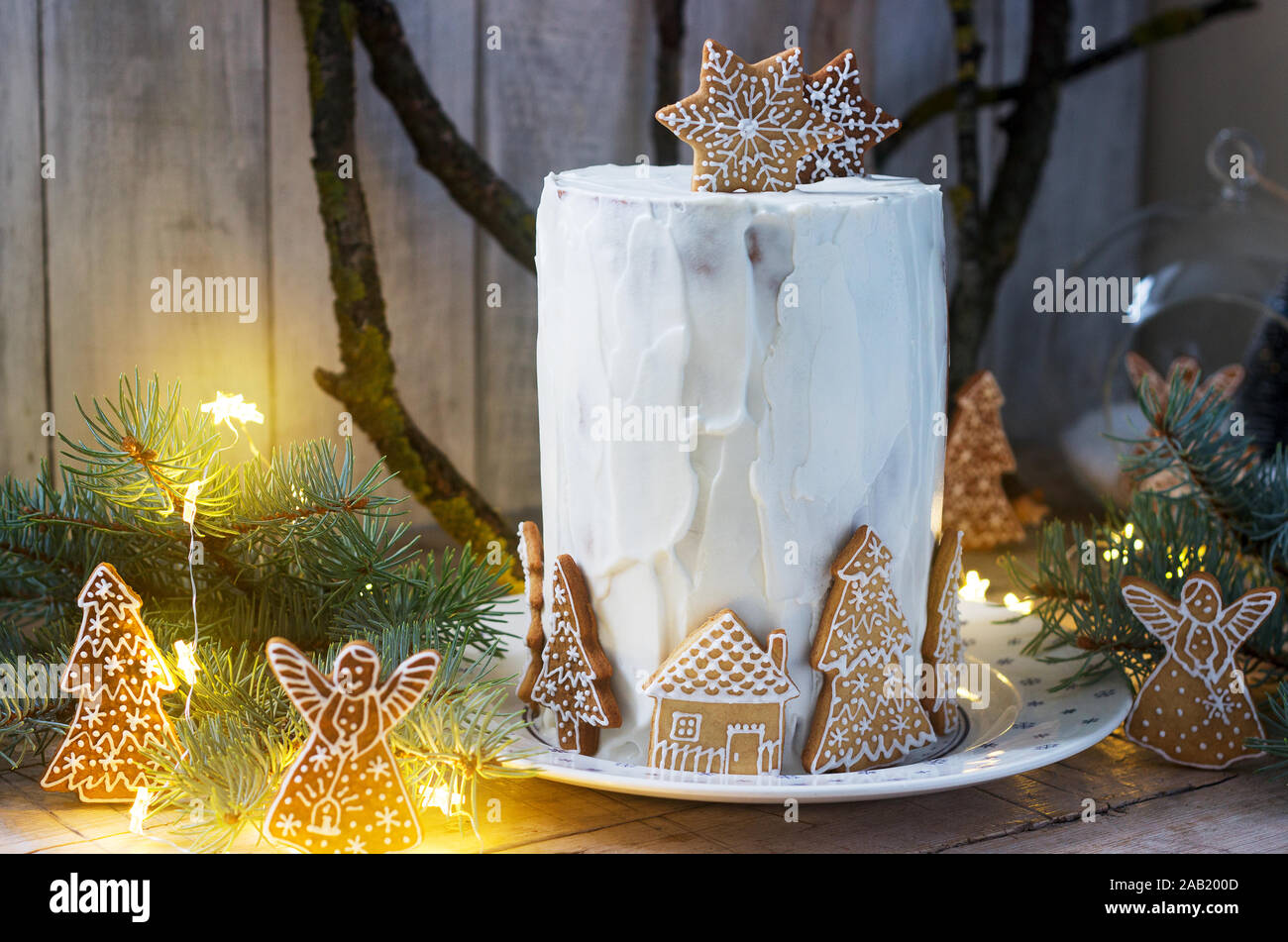 Homemade honey cake with sour cream, decorated with gingerbread. Rustic ...