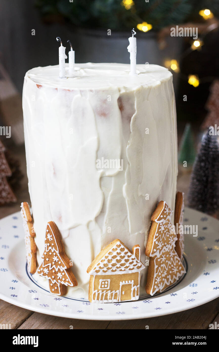 Homemade honey cake with sour cream, decorated with gingerbread. Rustic ...
