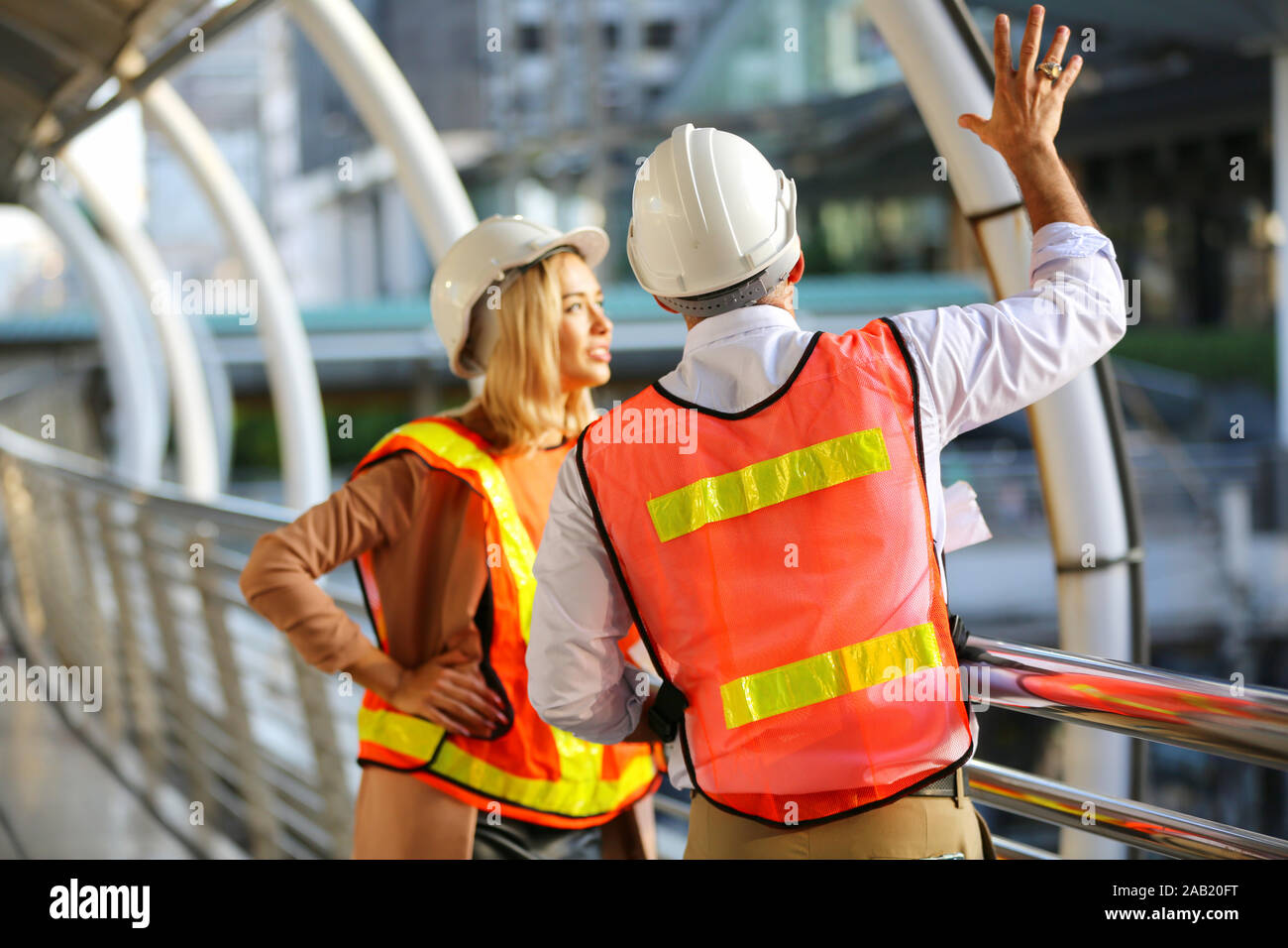 The engineer and business people hand high five against building. The ...