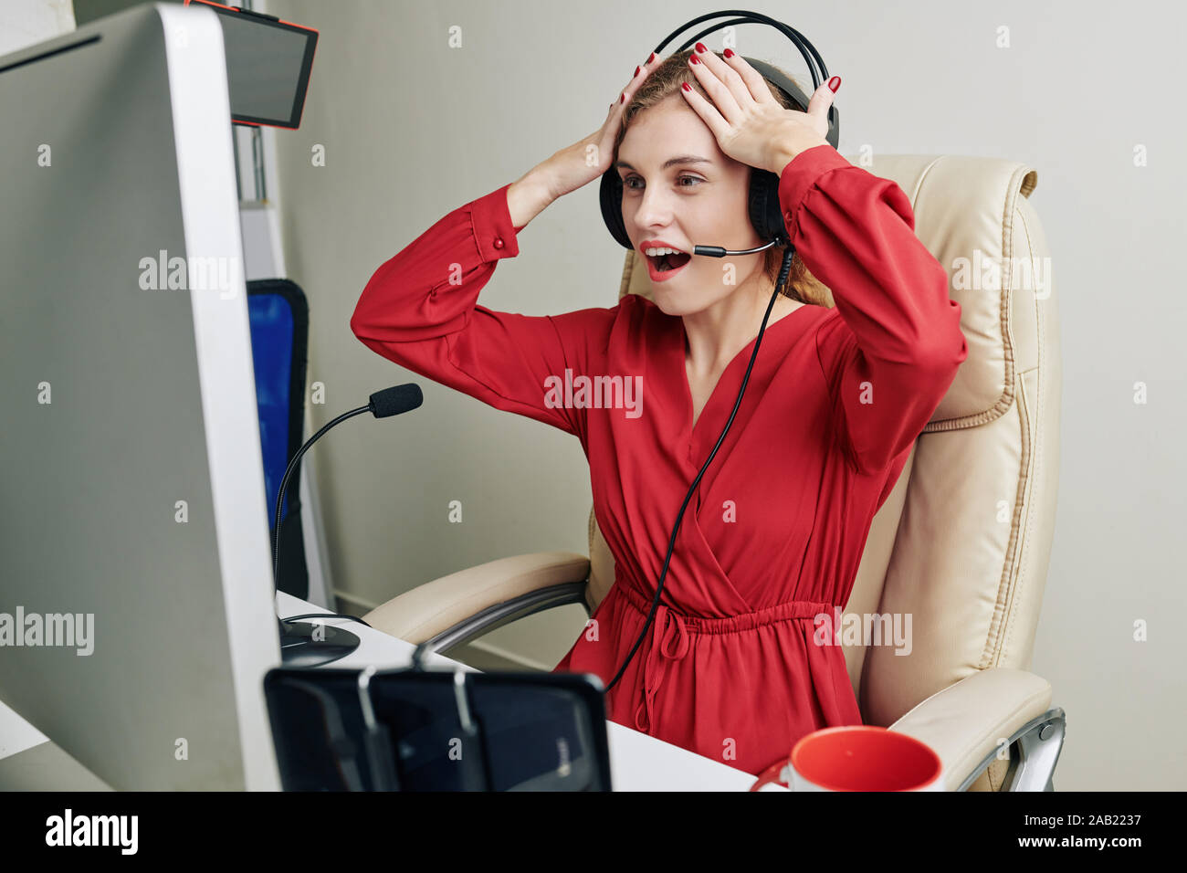 Emotional female streamer clutching her head in despair as she lost the ...