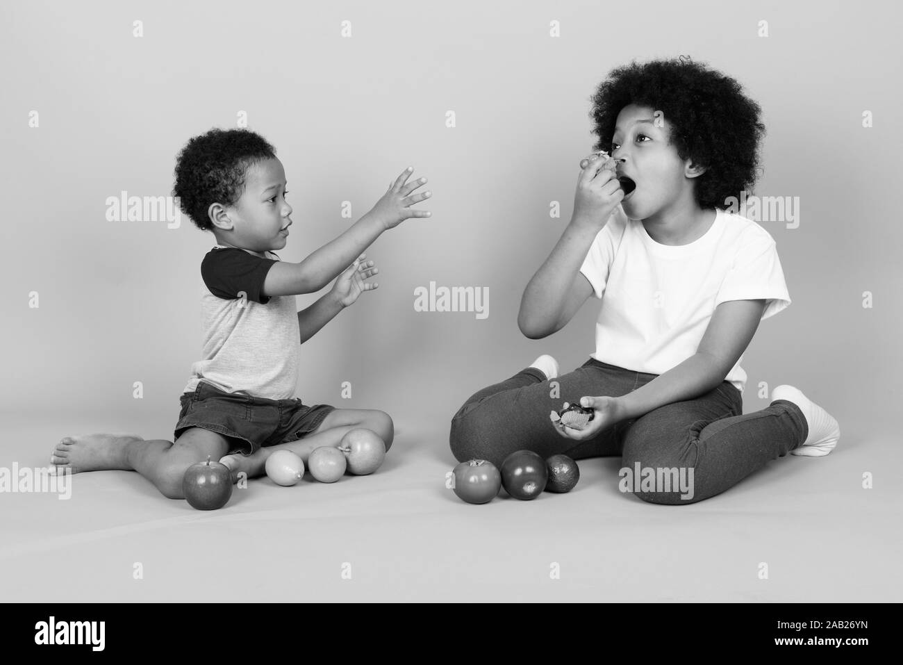 Young cute African siblings together in black and white Stock Photo - Alamy