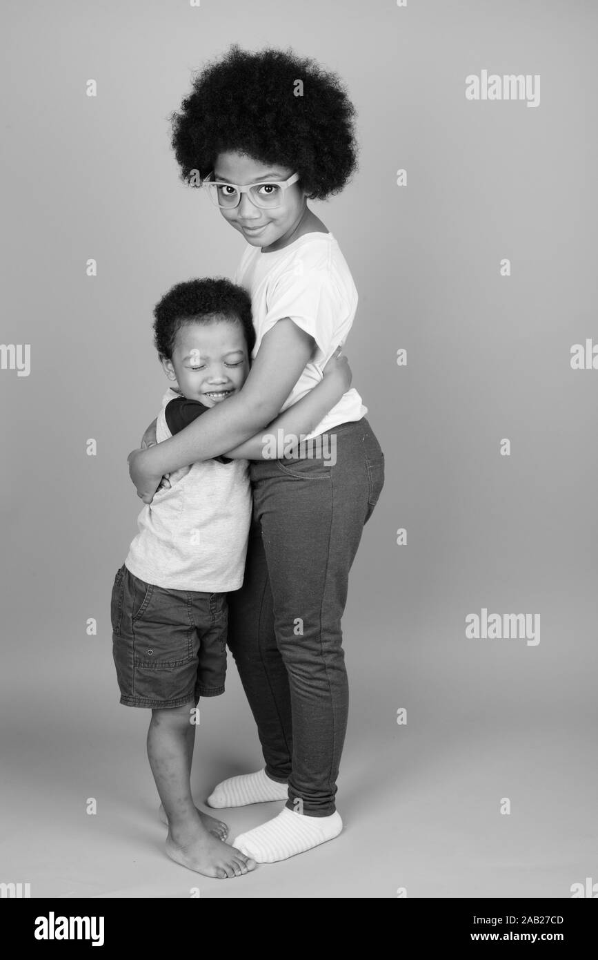 Young cute African siblings together in black and white Stock Photo - Alamy