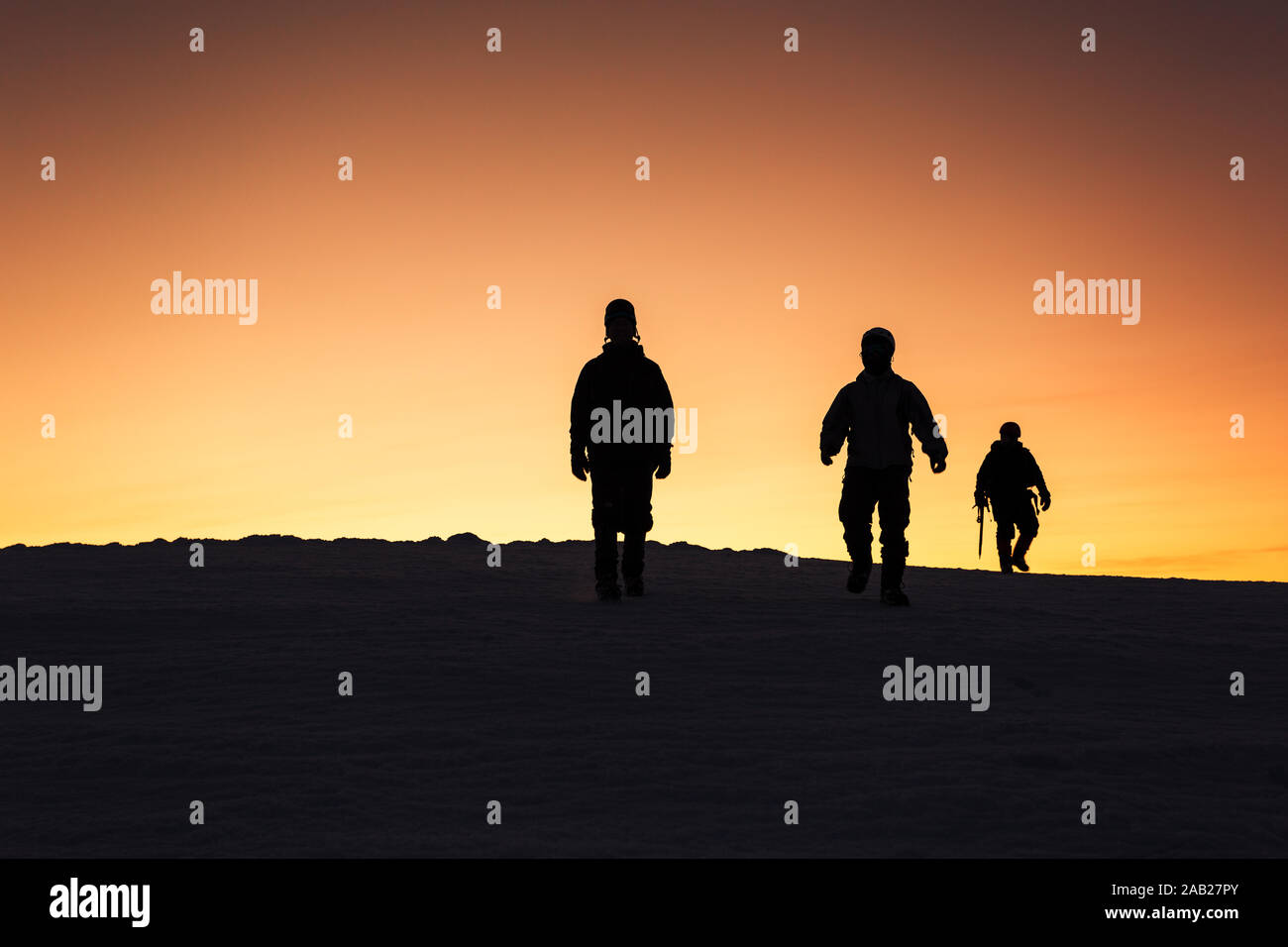 Three men climbing mountain hi-res stock photography and images - Alamy