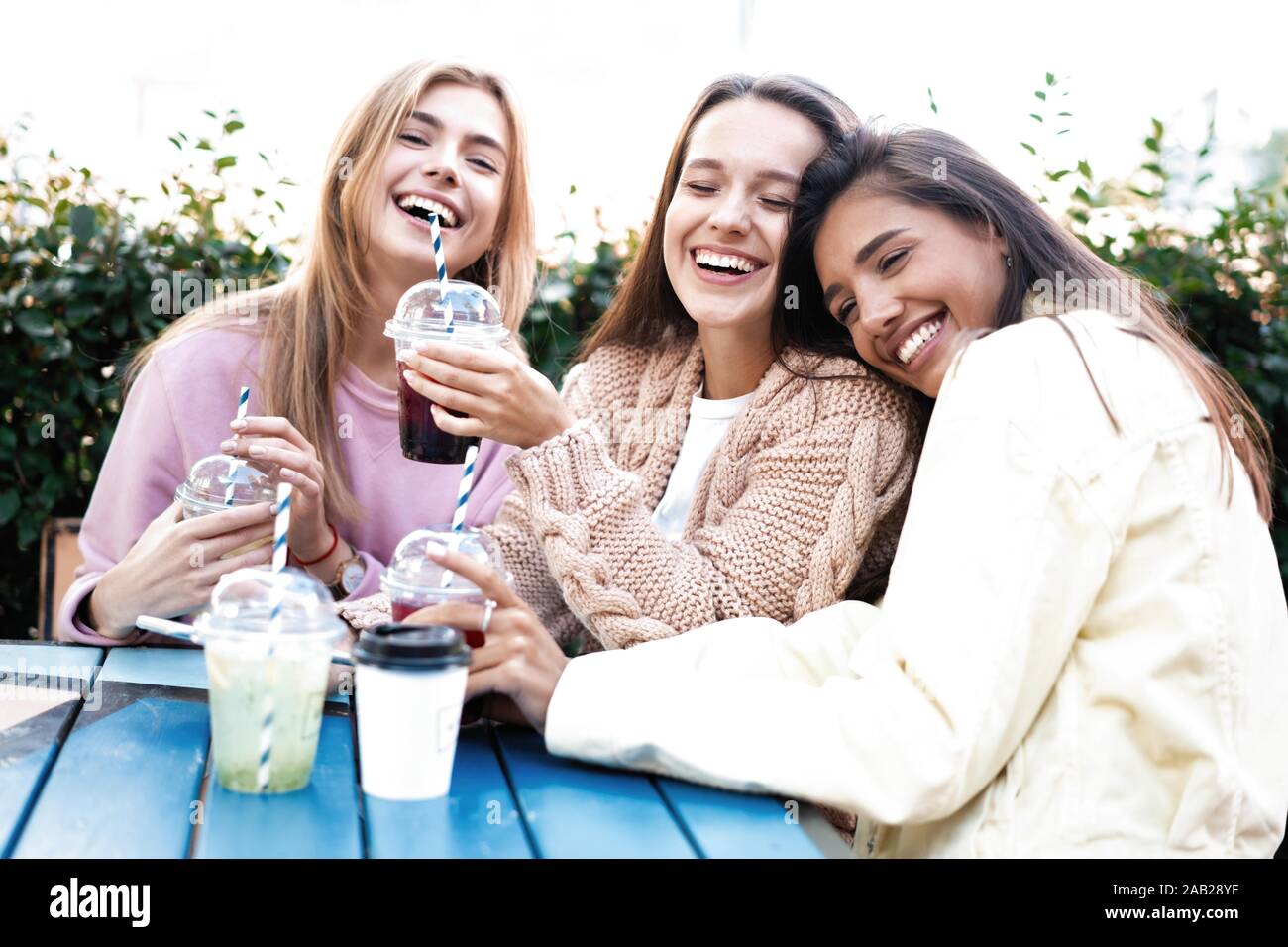 Group Of Friends Drinking Cocktails At Outdoor Bar Stock Photo - Alamy