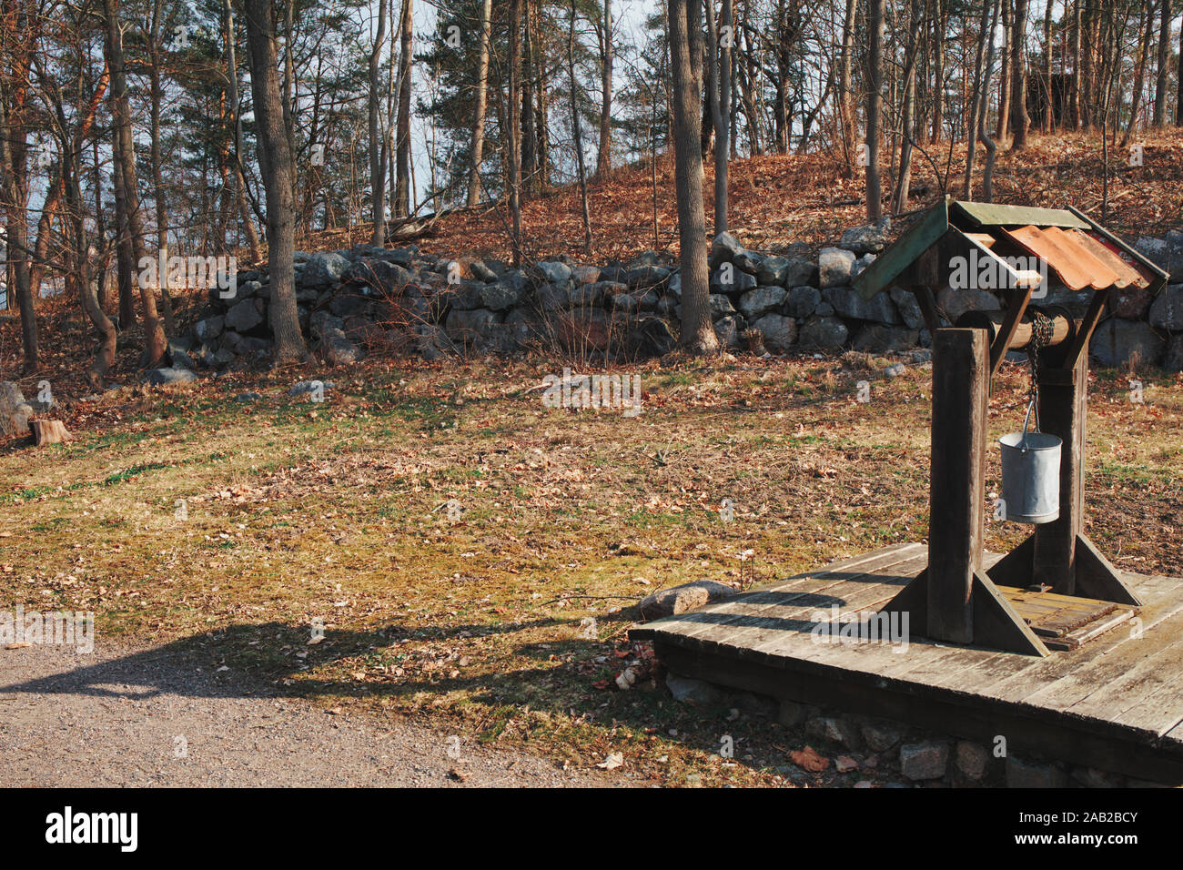 Traditional wooden draw well with metal bucket, Fjaderholmarna island ...