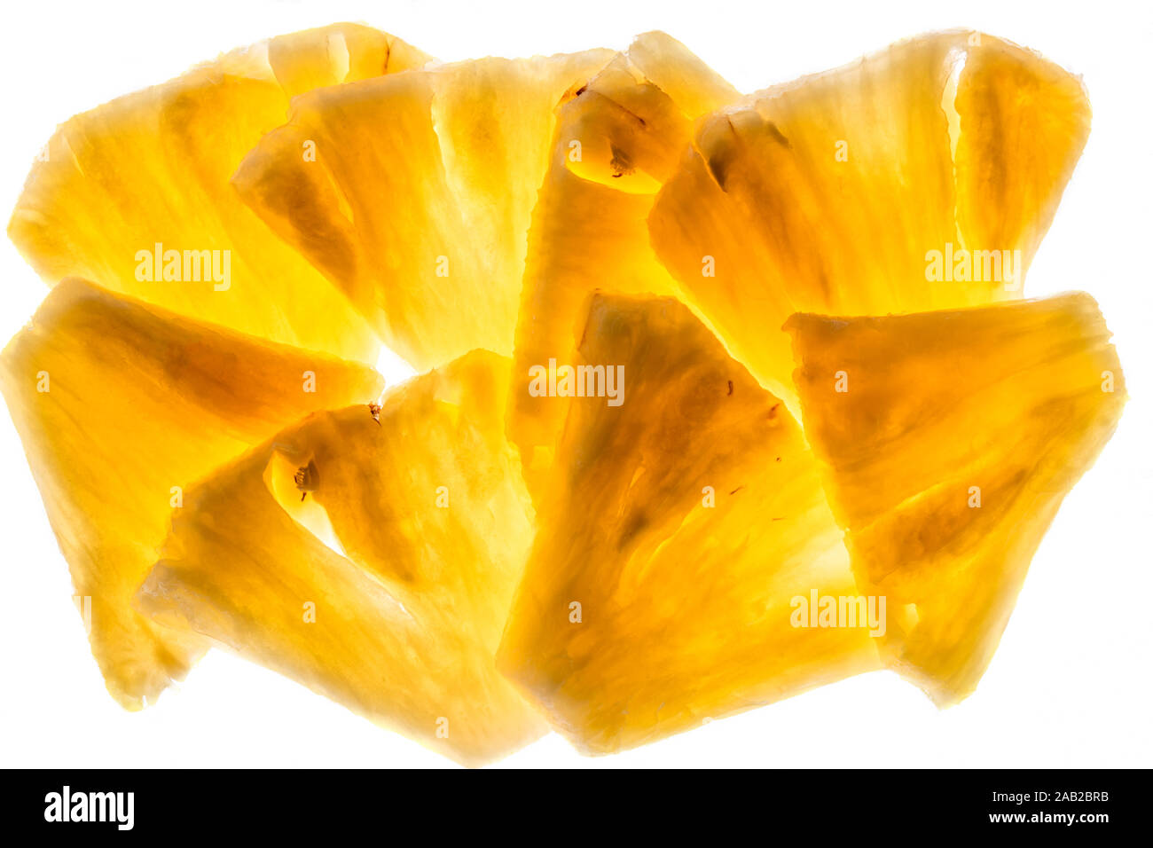 Pineapple chunks isolated on white background Stock Photo - Alamy
