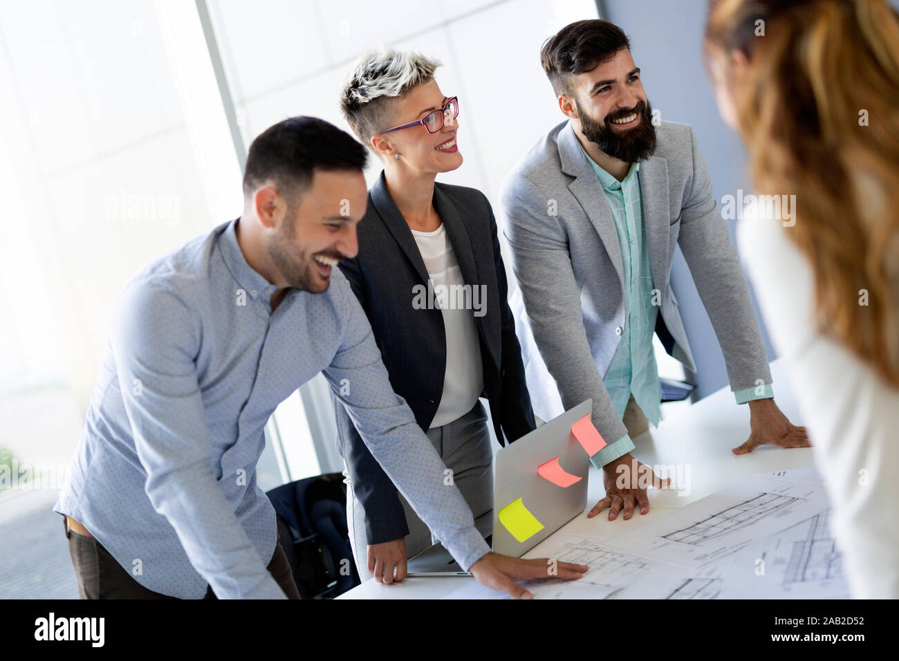 Group of business people collaborating in office Stock Photo - Alamy