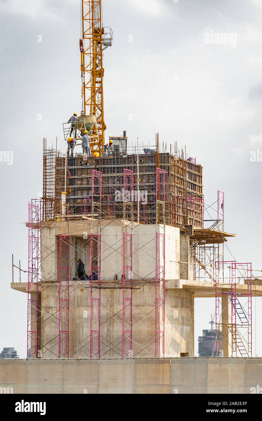 Aerial view of a building construction with tower crane, scaffolding ...