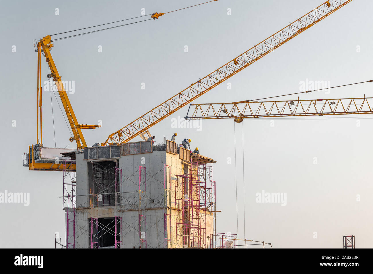 Aerial view of a building construction with tower crane, scaffolding ...