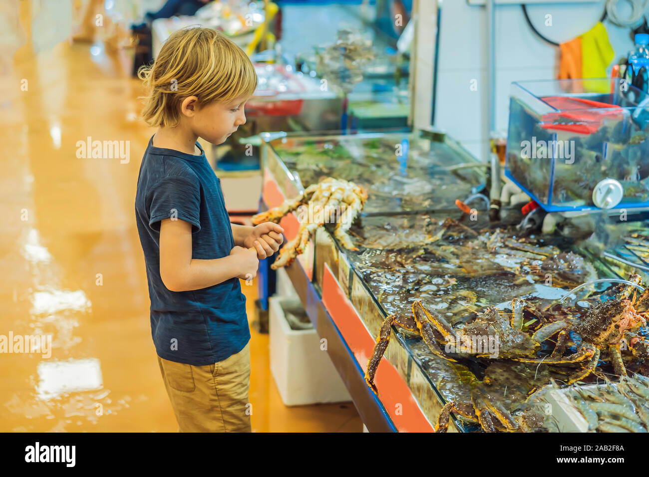 Children eating fish in hi-res stock photography and images - Alamy