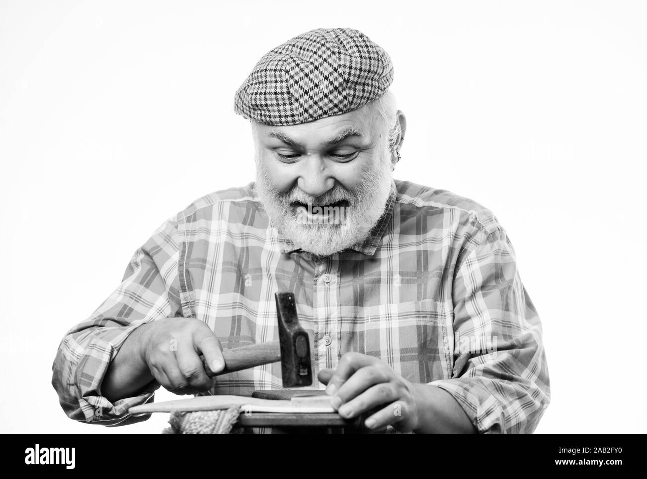 retro man repair shoes with hammer. shoemaker working with leather ...