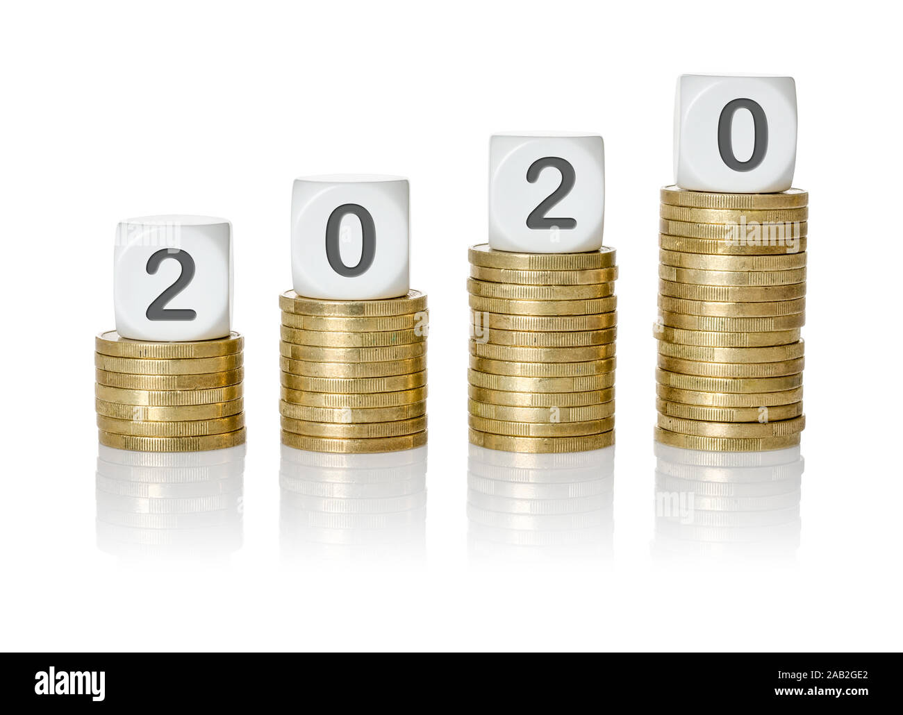 Rising coin stacks with letter dice - 2020 Stock Photo - Alamy