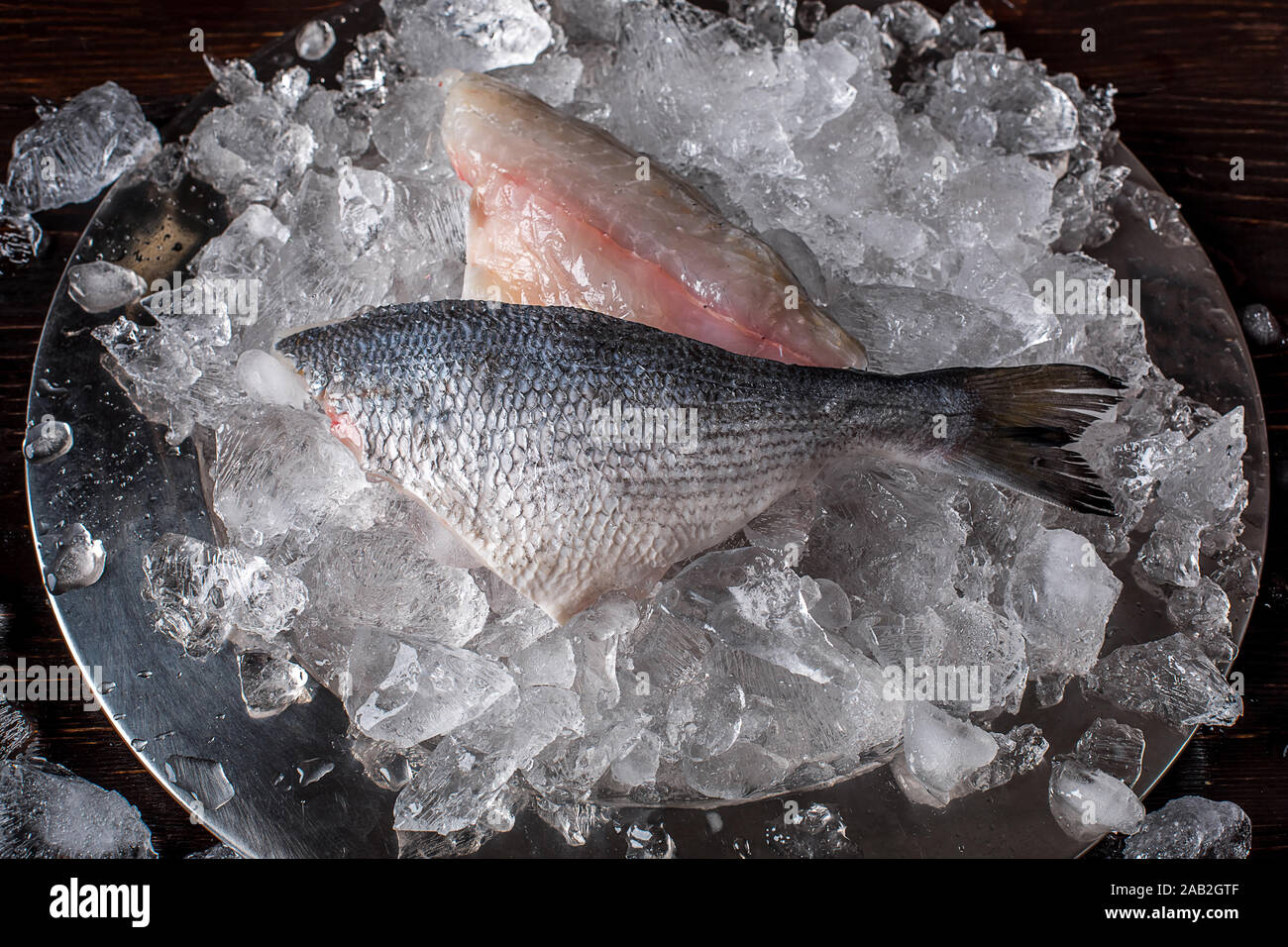 Seafood cooking preparation. Top view of dorado fillet on ice Stock ...