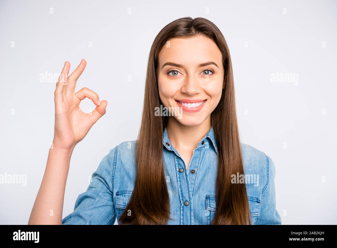 Close up photo of confident cool promoter girl show ok sign pick tips ...