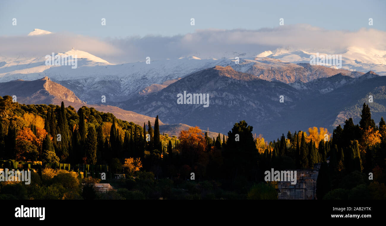Snow covered Sierra Nevada mountains viewed at sunset from Mirador San ...
