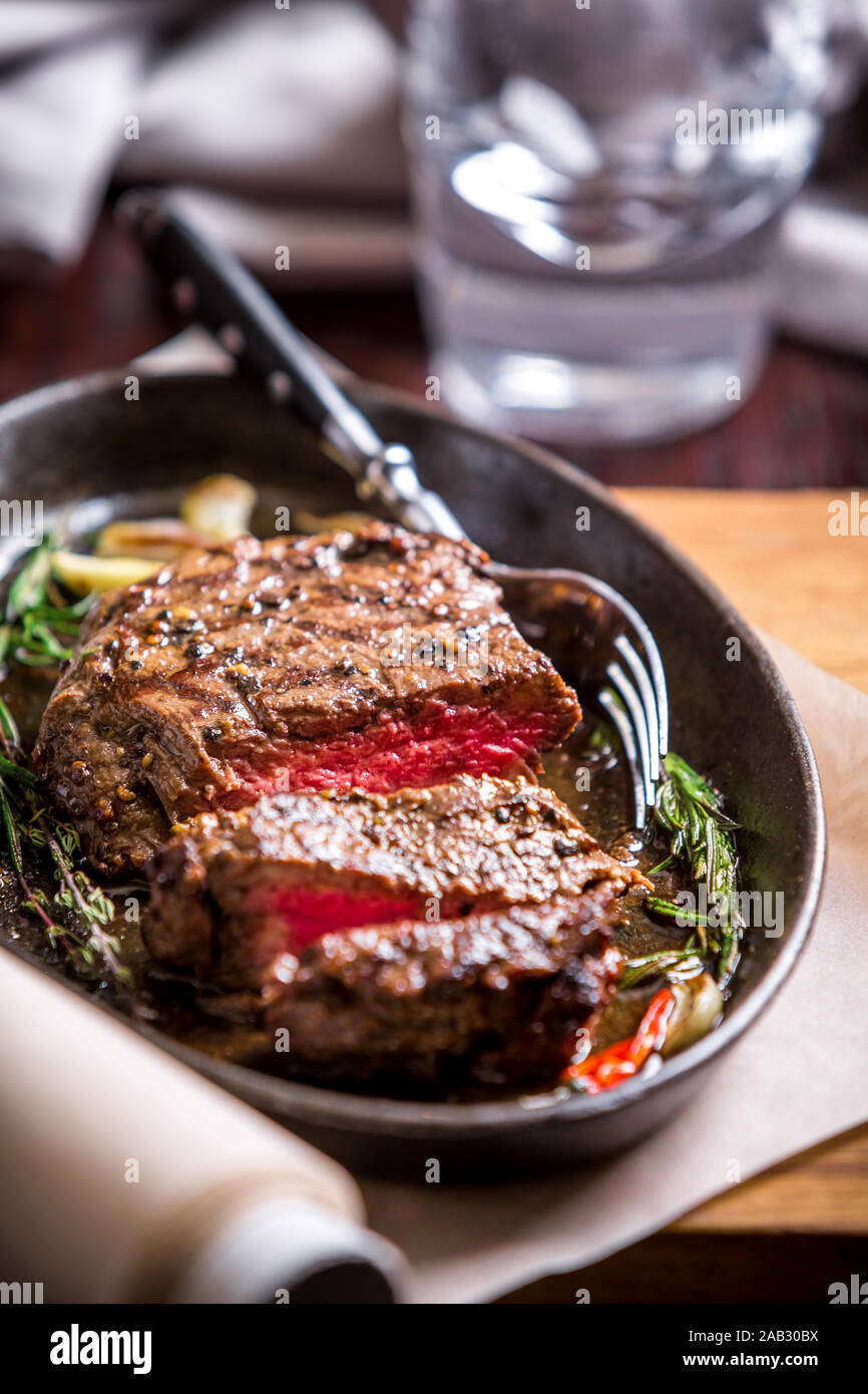 Healthy lean grilled medium-rare steak and vegetables Stock Photo - Alamy