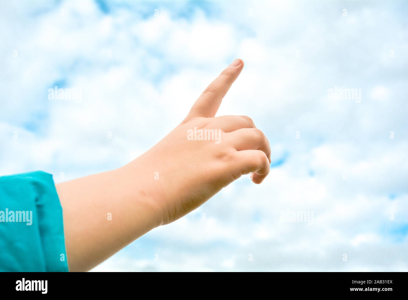 Close up of hand of child with exposed index finger in blue sleeve ...
