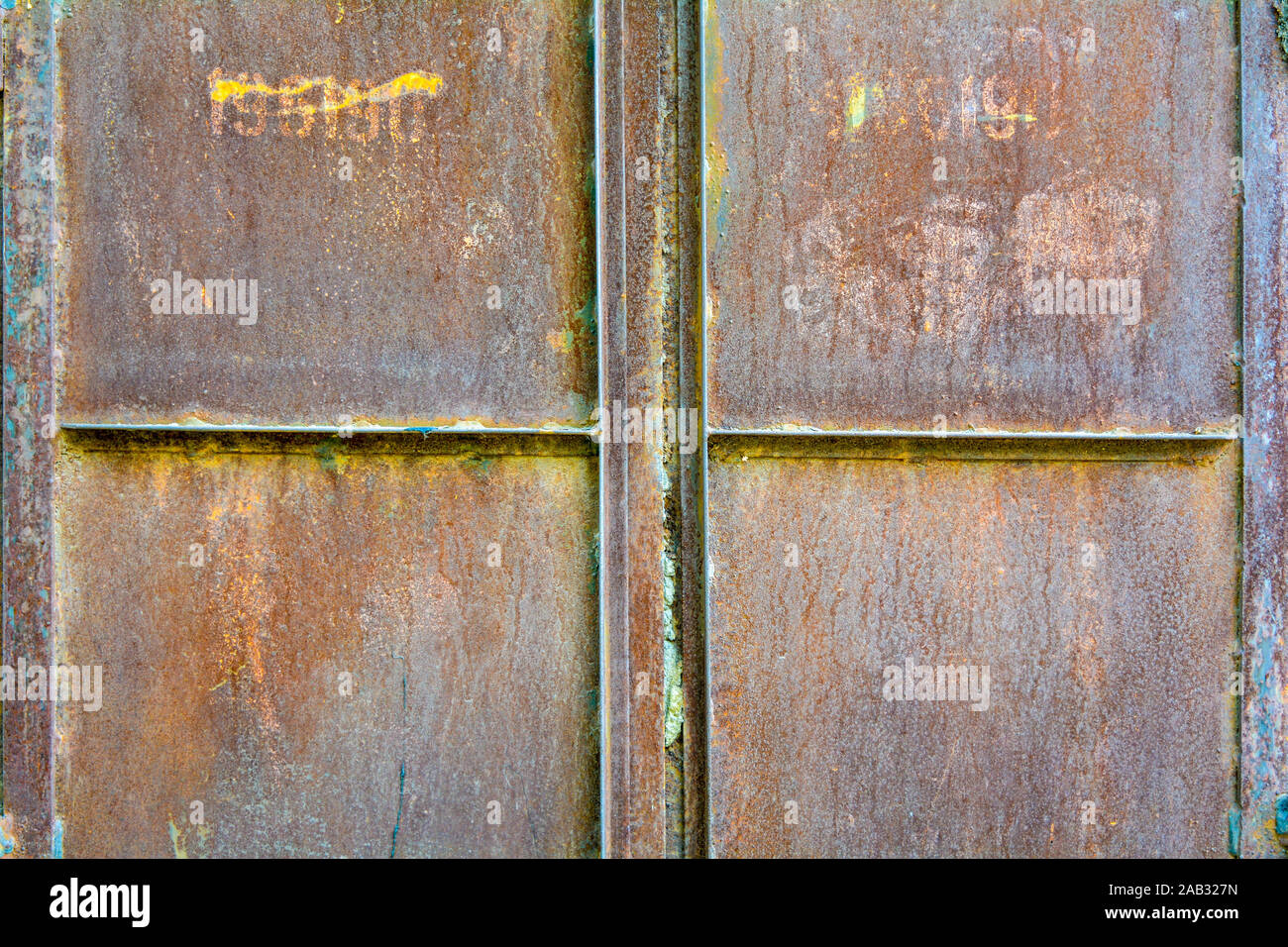 Detail of rusty corroded metal flat shutter or door. Old red metal ...