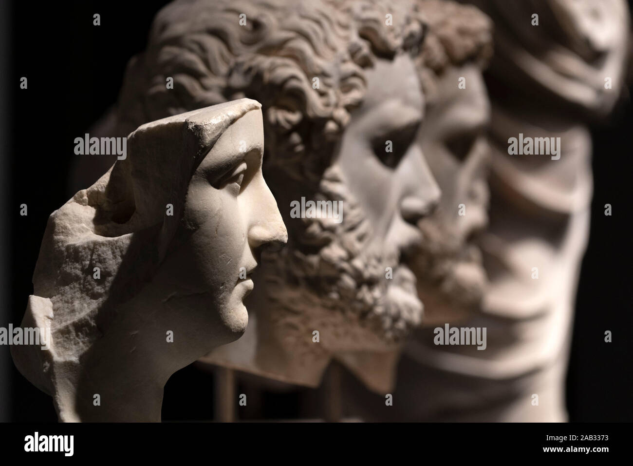 ancient roman head marble sculpture isolated on black background Stock ...